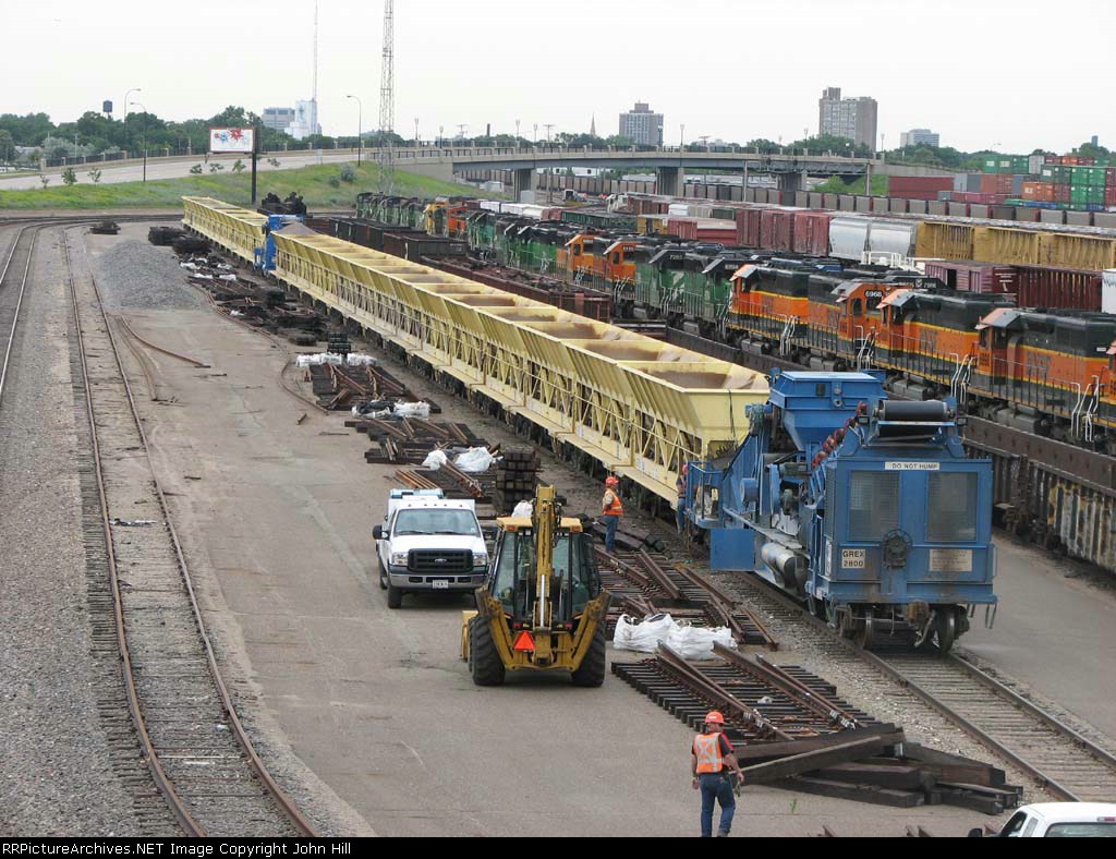 070621008 GREX 2800 and ballast-unloading train in BNSF Northtown "T" Yard